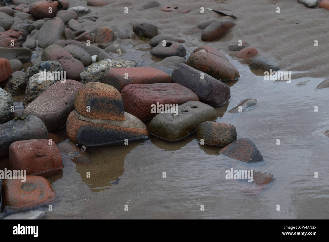 Sea worn bricks Stock Photo - Alamy