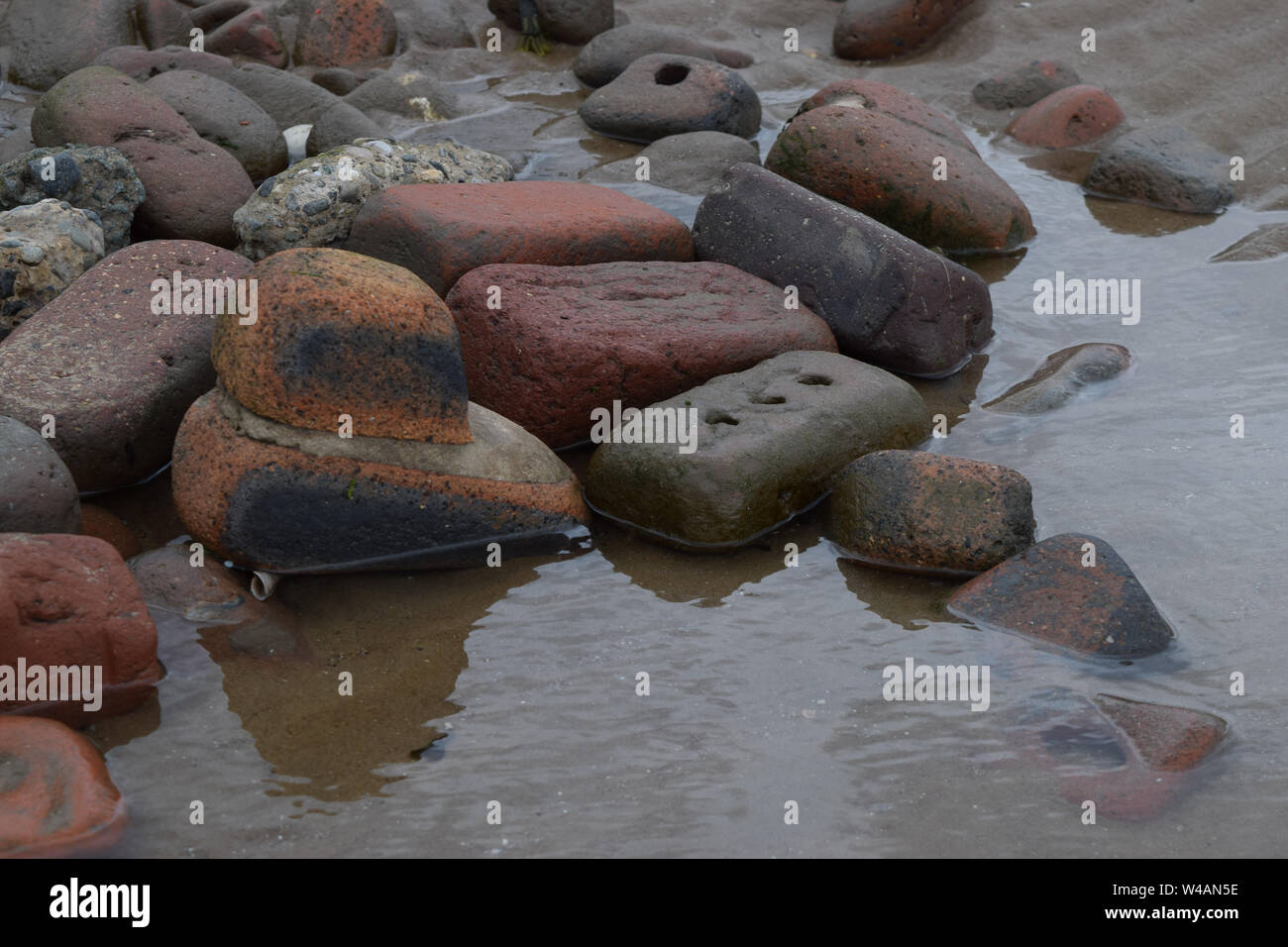 Sea worn bricks Stock Photo - Alamy