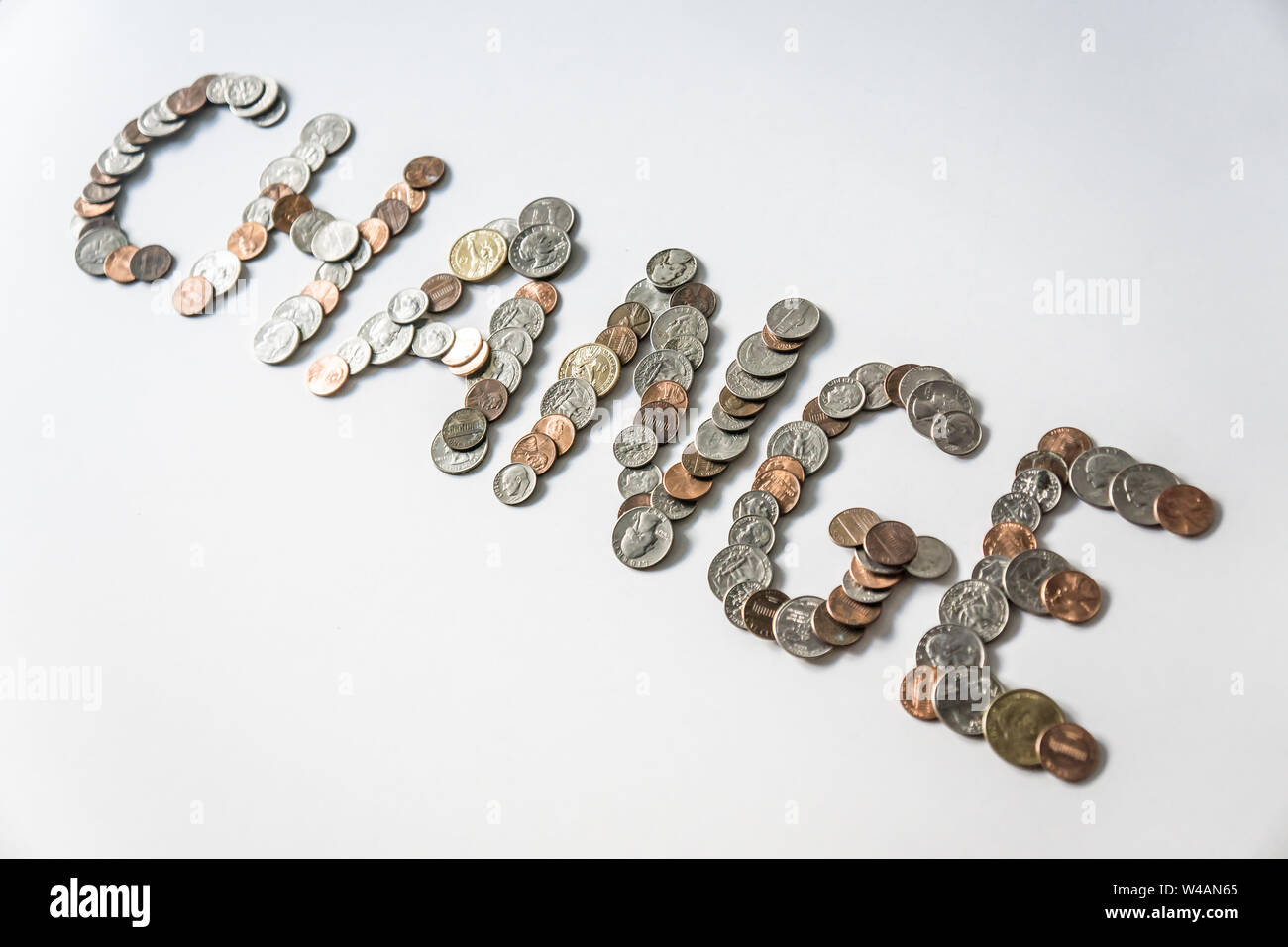 Coins isolated on solid white background spelling the word Change from ...