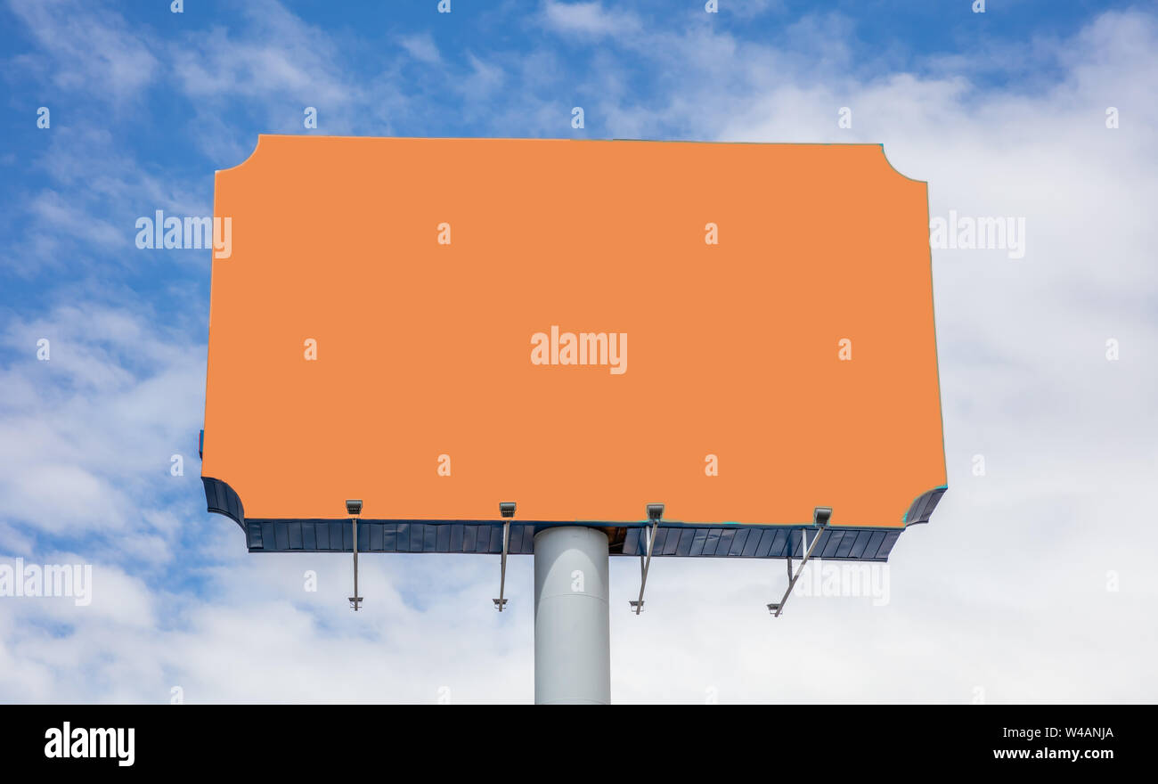 Billboard blank orange color, for advertisement in a spring sunny day ...