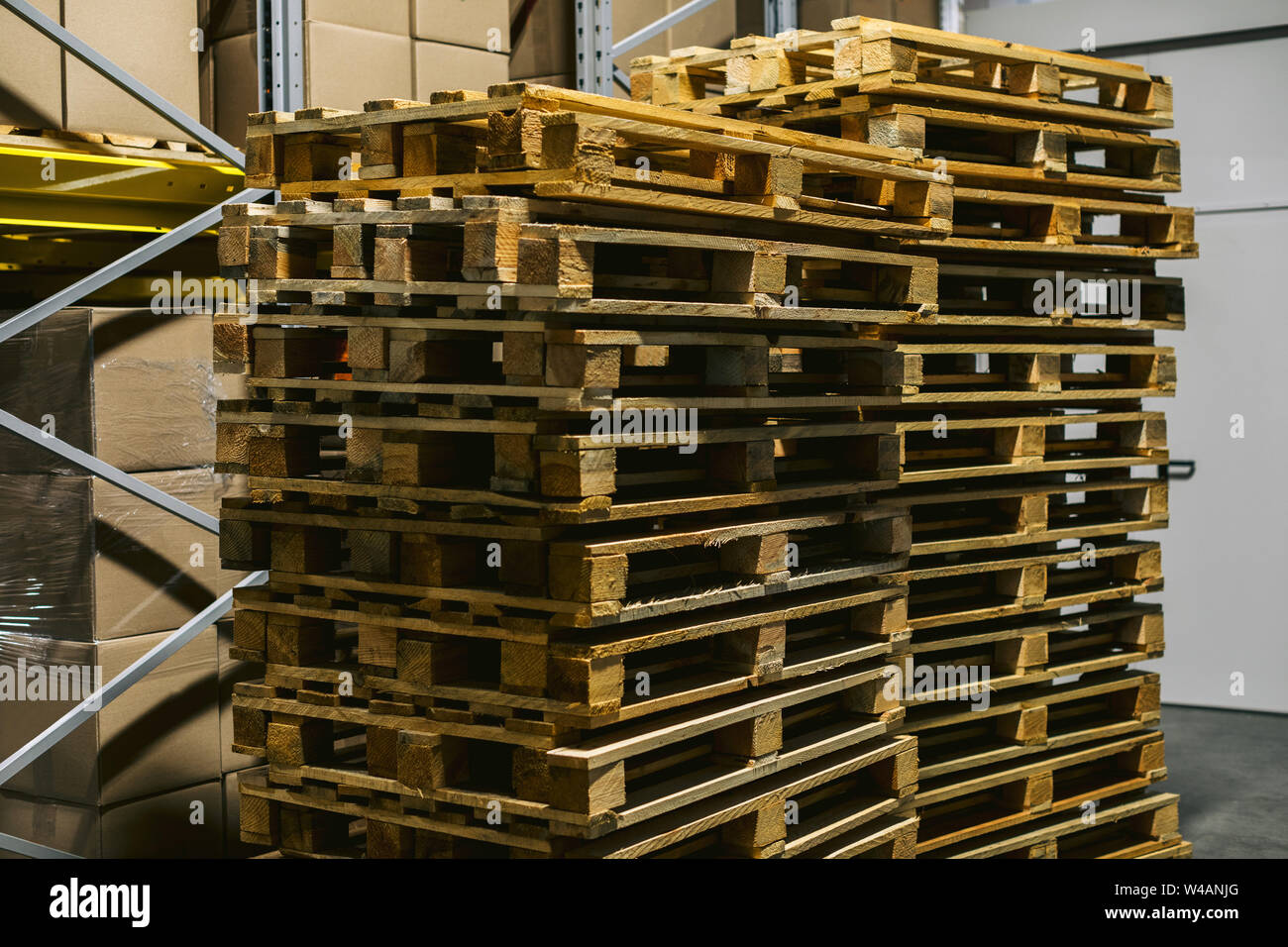 stack of wood pallet in factory warehouse Stock Photo - Alamy