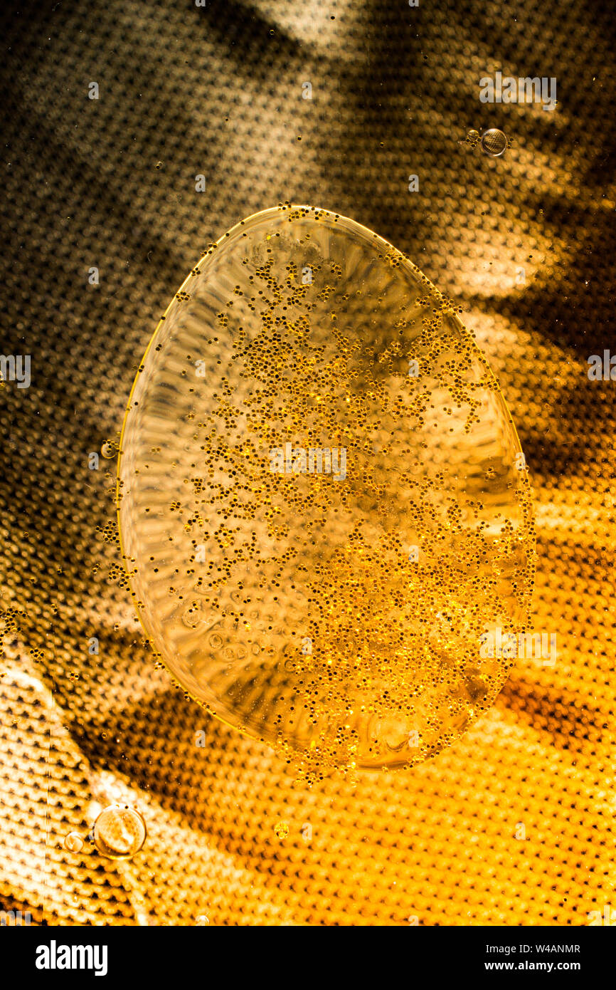 Air and oil bubbles inside water base form patterns Stock Photo - Alamy
