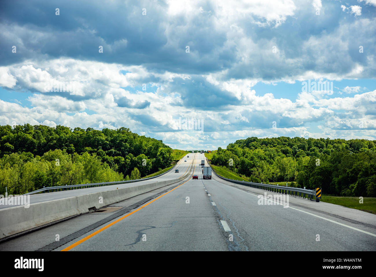 Highway in a sunny spring day, USA. National road, passing through ...