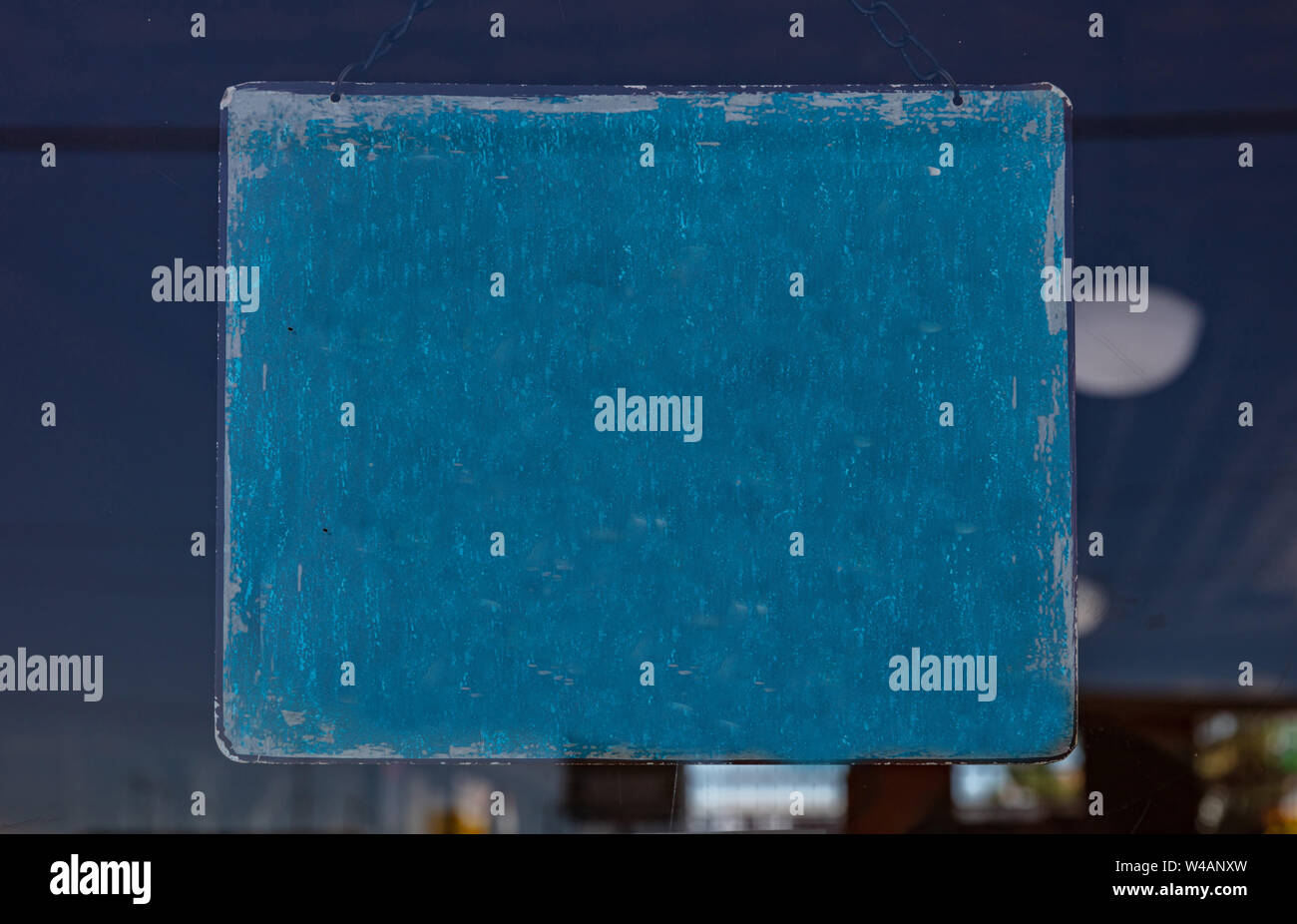 Shop blank sign. Blank sign, blue color, faded and old hanging on a ...