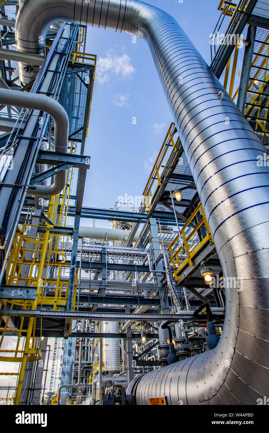 Pipe racks in a refinery during morning light Stock Photo - Alamy