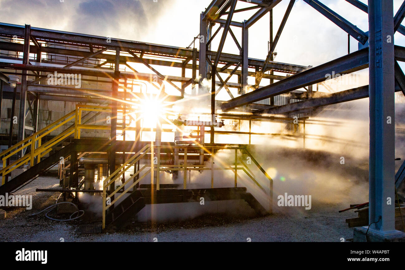 Tank car loading facility inside a refinery at sunrise Stock Photo - Alamy