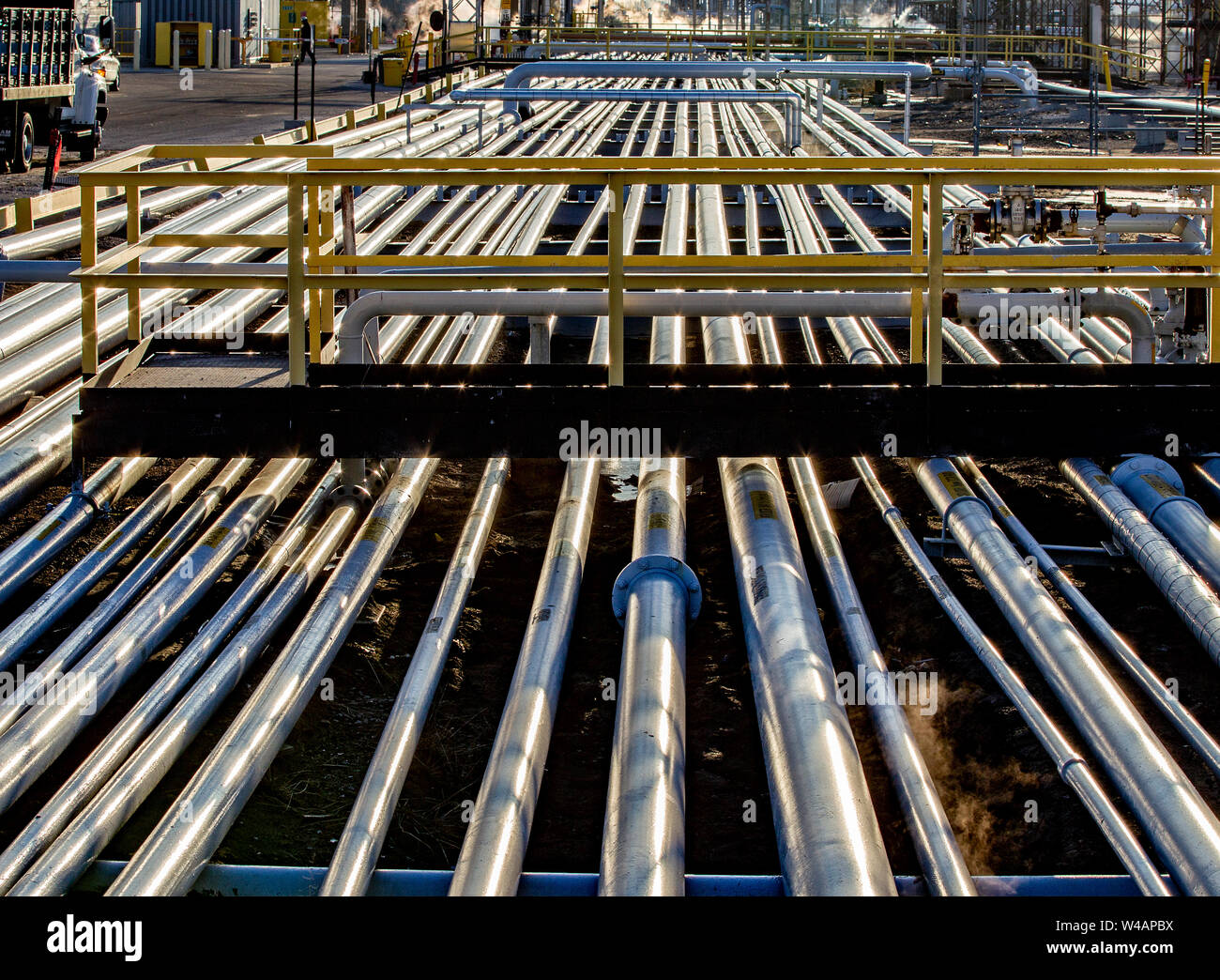 Pipe alley in a refinery in the early morning Stock Photo - Alamy
