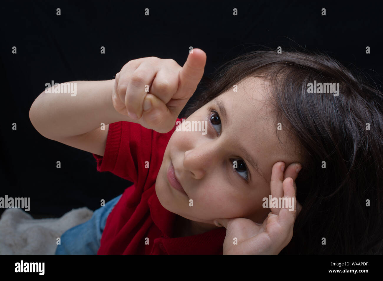 Happy smiling kid boy ipointing finger Stock Photo - Alamy