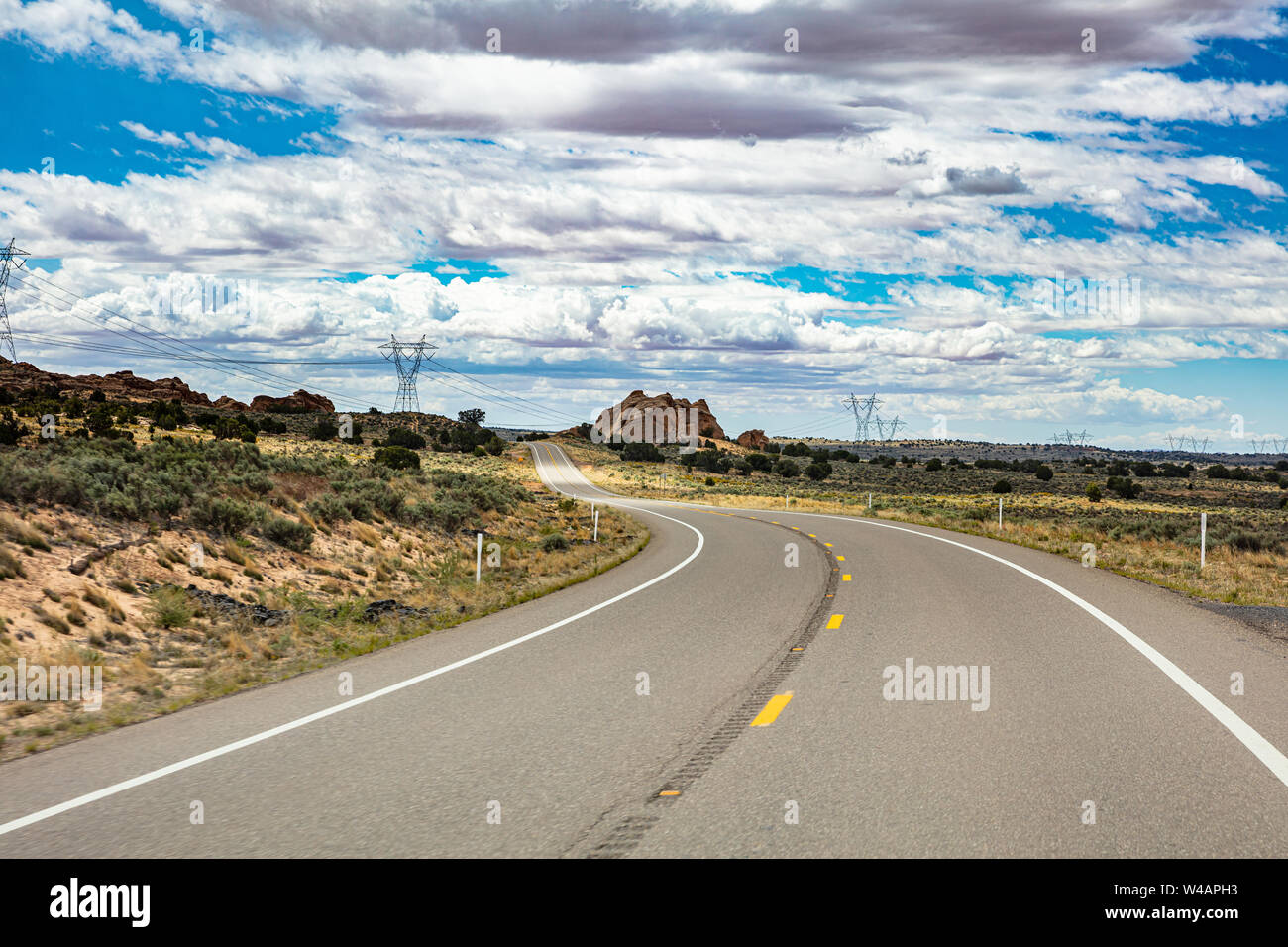 Highway in a sunny spring day, countryside USA. Empty winding road ...