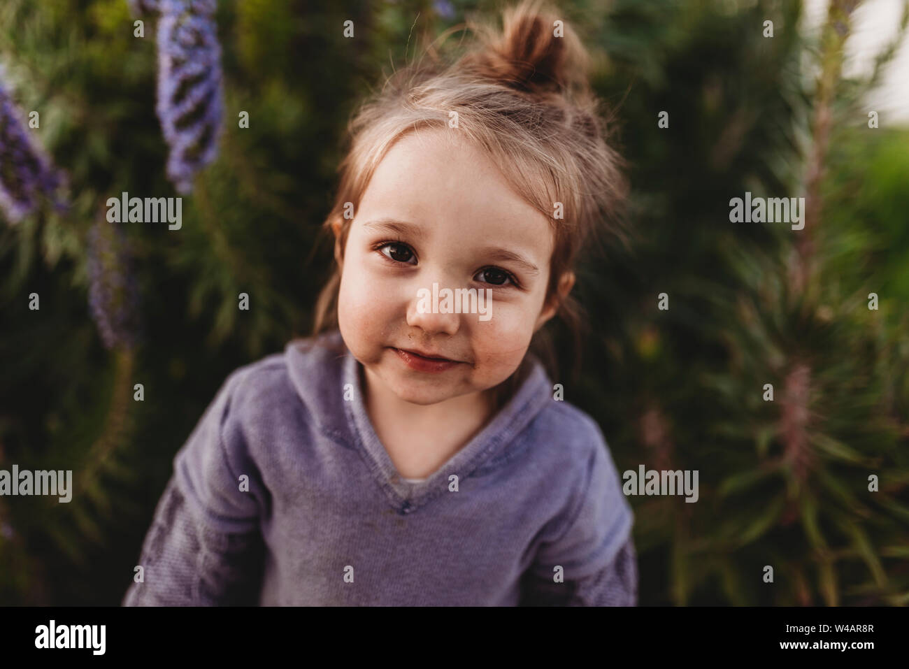Portrait of little girl with dirty face sweetly smiling Stock Photo - Alamy