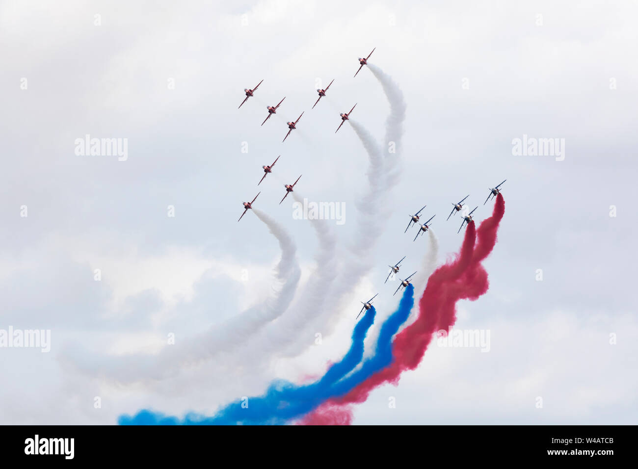 Red Arrows formation flight with the Patrouille de France flying on ...