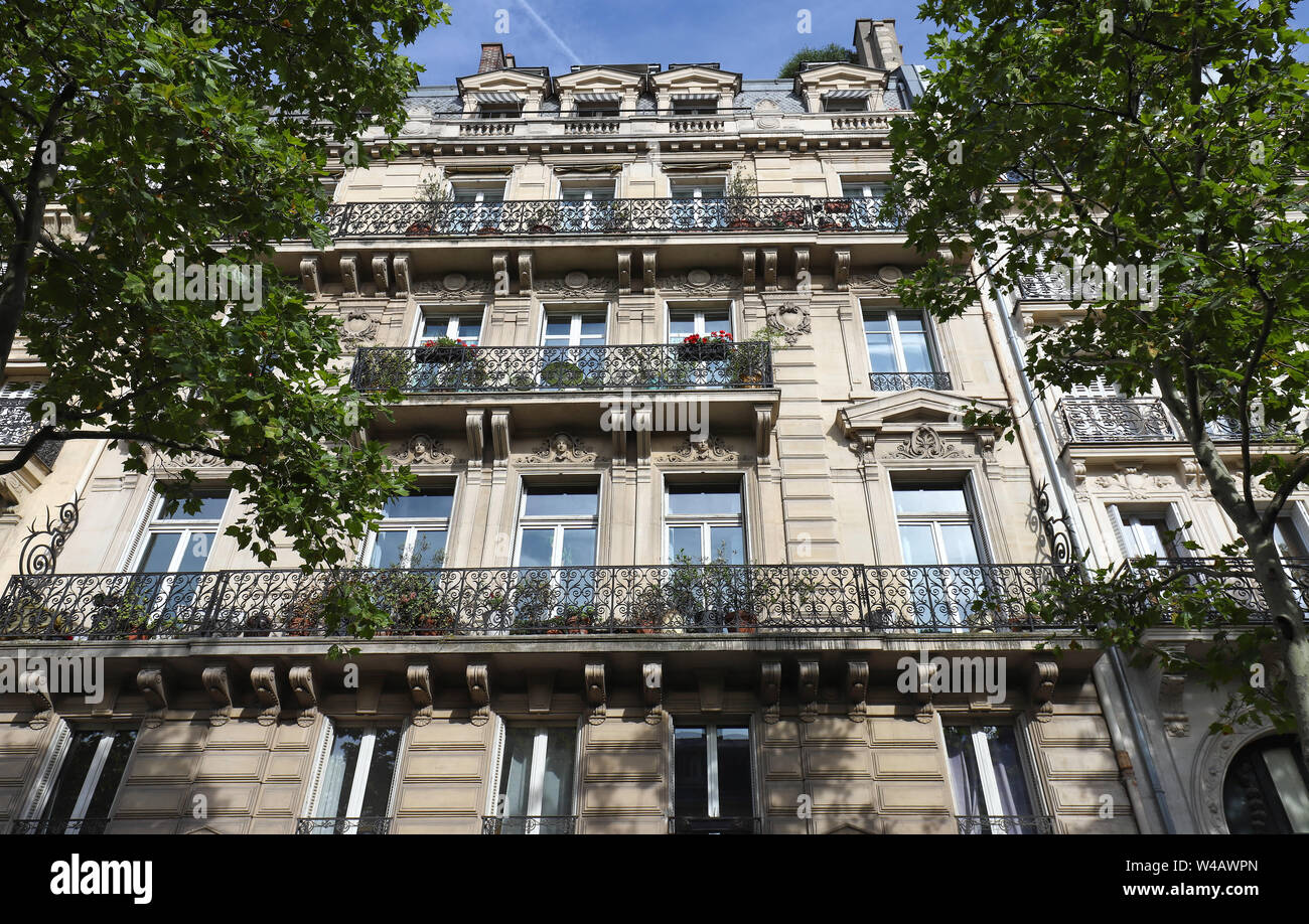 Traditional French house with typical balconies and windows. Paris ...