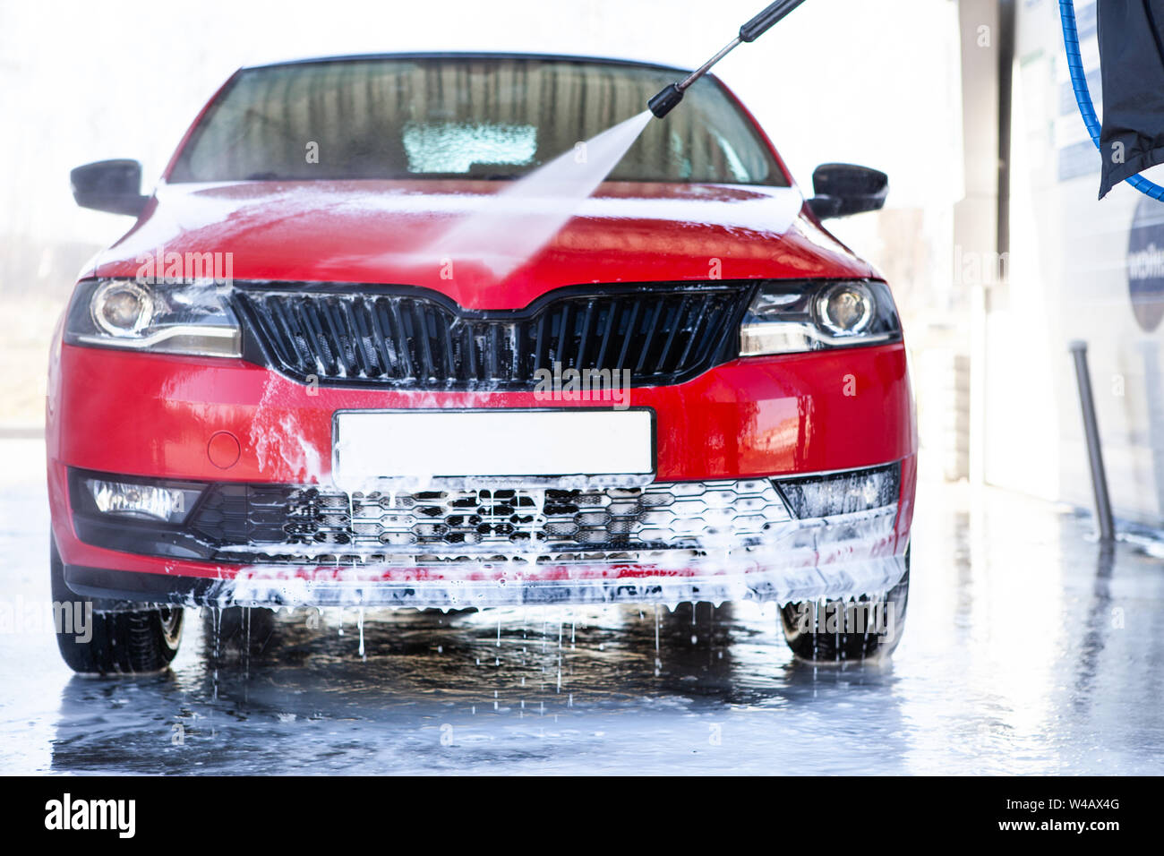 Car washing. Cleaning car using high pressure water Stock Photo - Alamy