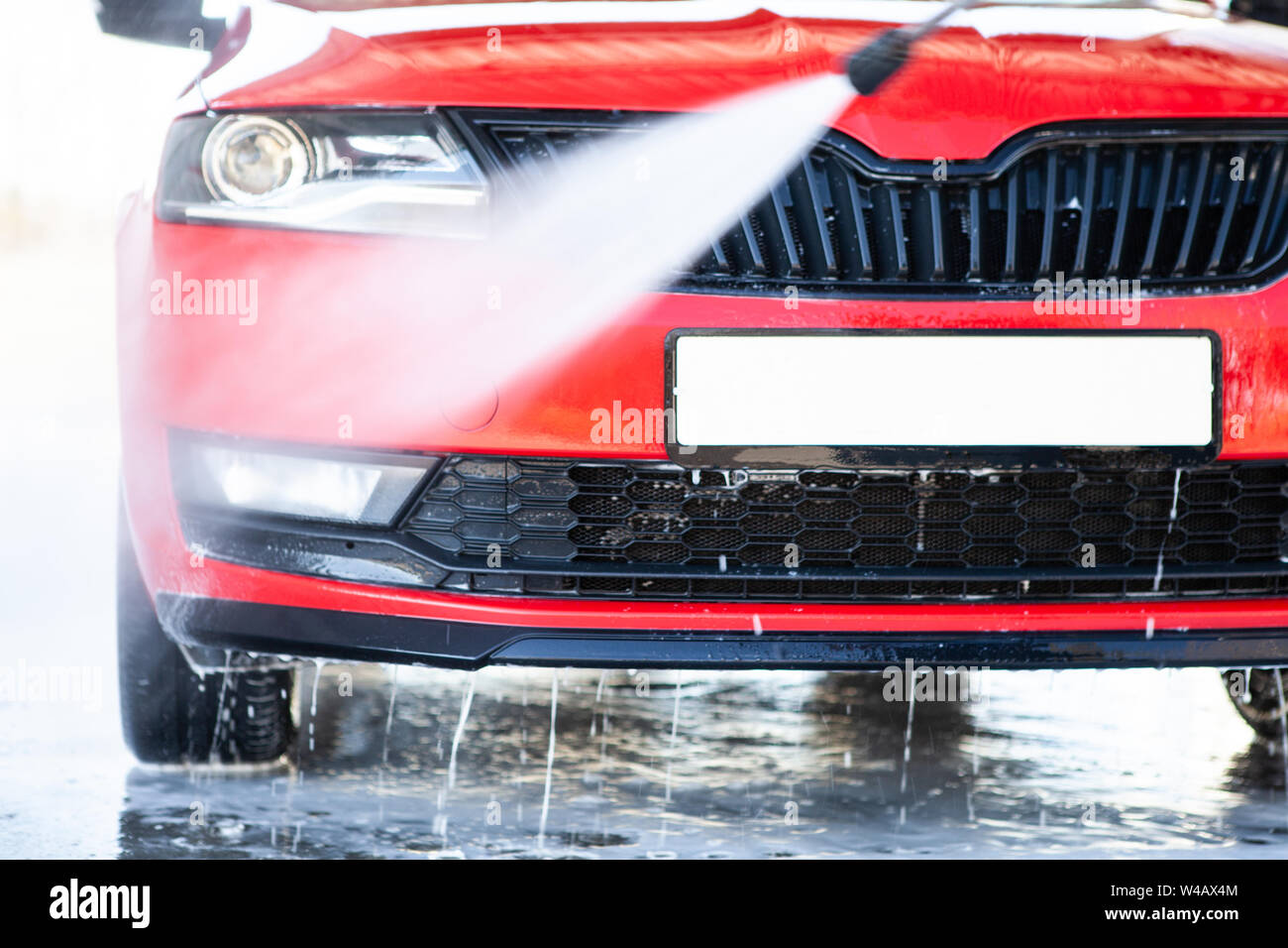 Car washing. Cleaning car using high pressure water Stock Photo - Alamy