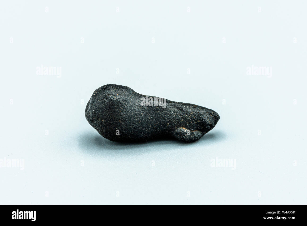 Black magnetic Tektite Meteorite isolated, piece of rock formed in big ...