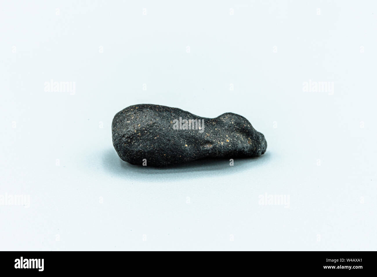 Black magnetic Tektite Meteorite isolated, piece of rock formed in big ...