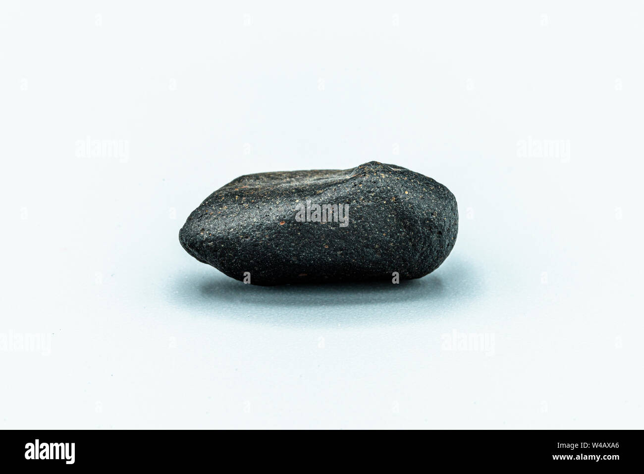 Black magnetic Tektite Meteorite isolated, piece of rock formed in big ...