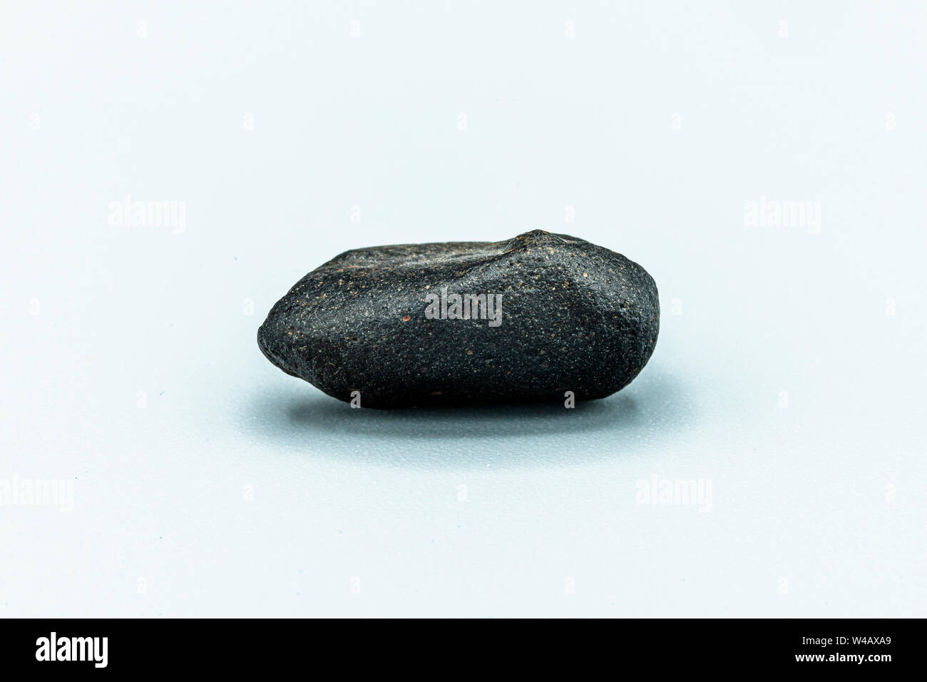 Black magnetic Tektite Meteorite isolated, piece of rock formed in big ...