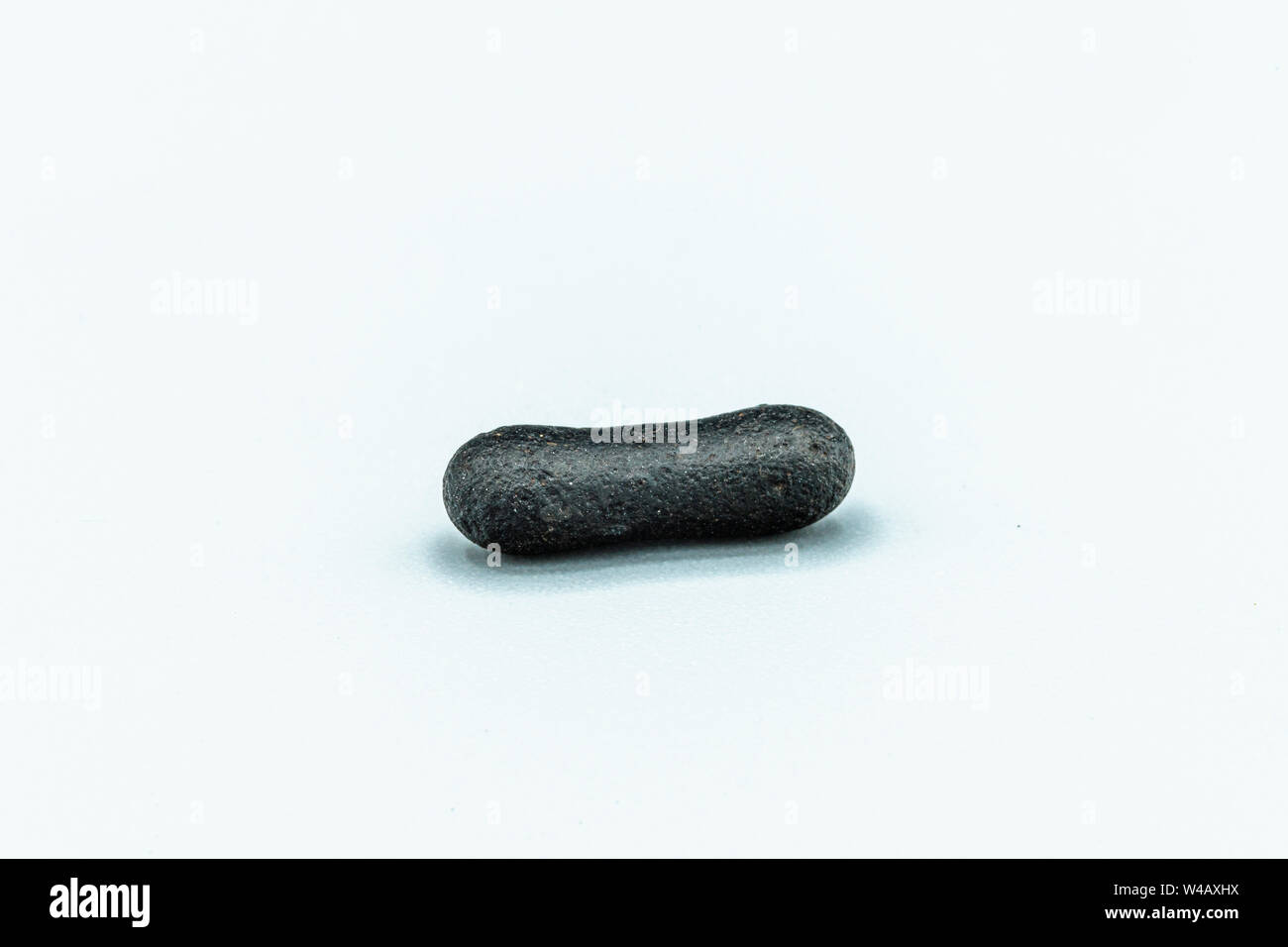 Black magnetic Tektite Meteorite isolated, piece of rock formed in big ...