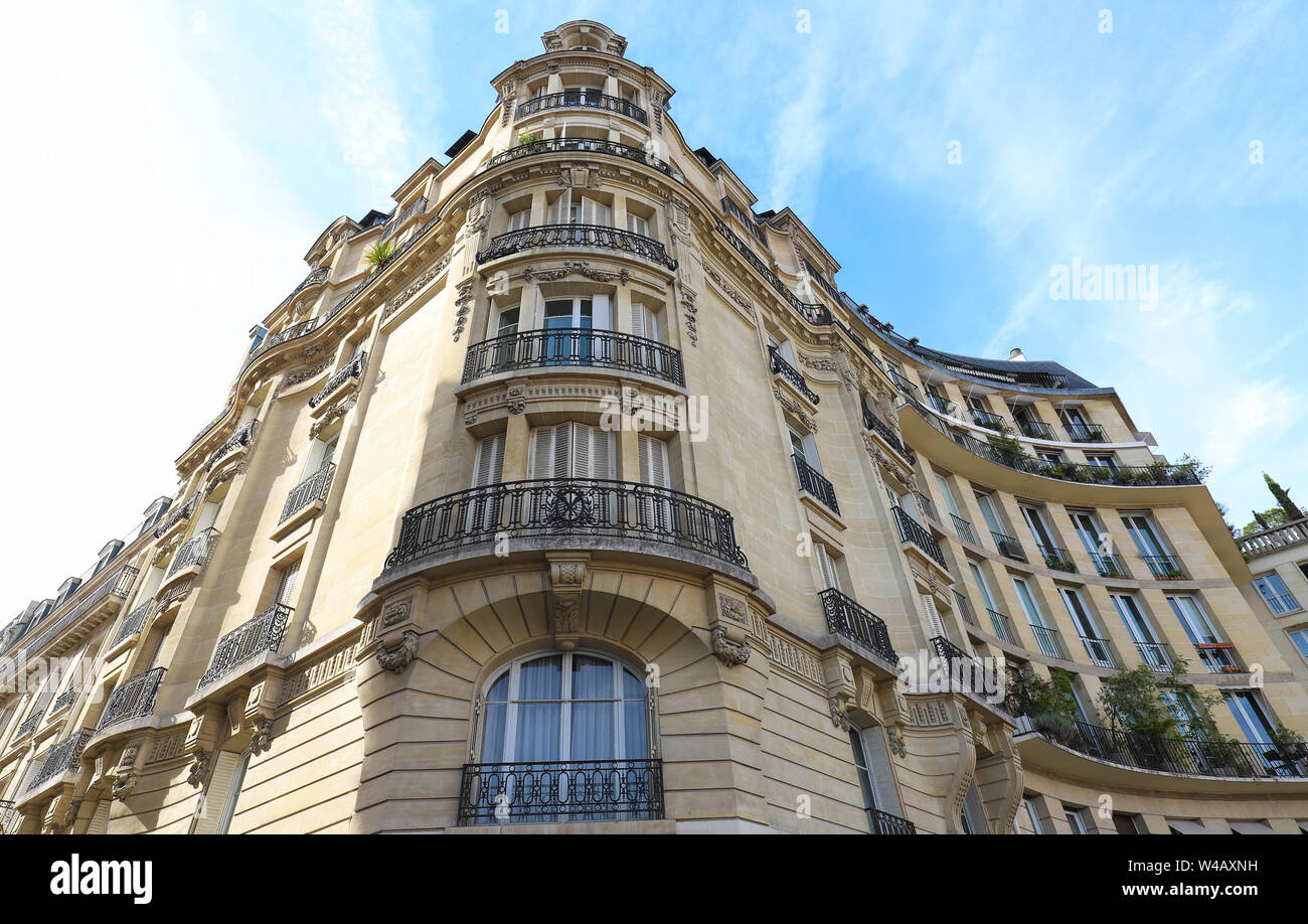 Traditional French house with typical balconies and windows. Paris ...