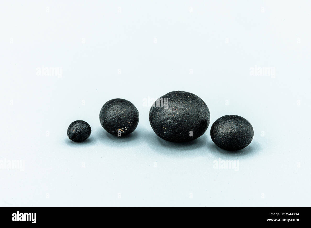 Black magnetic Tektite Meteorite isolated, piece of rock formed in big ...