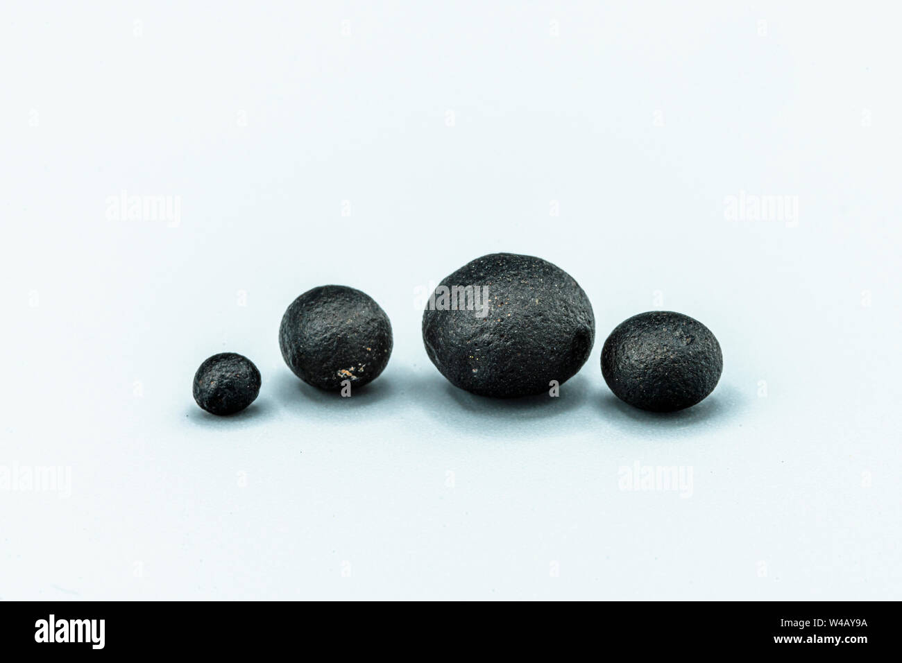 Black magnetic Tektite Meteorite isolated, piece of rock formed in big ...