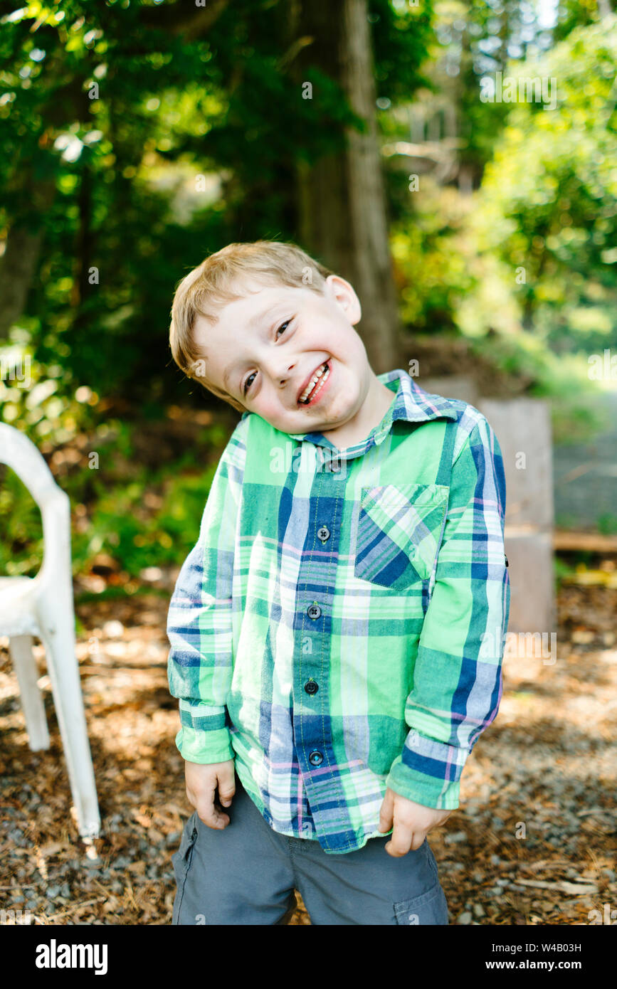 Straight on view of a young, smiling boy outside in the forest Stock ...