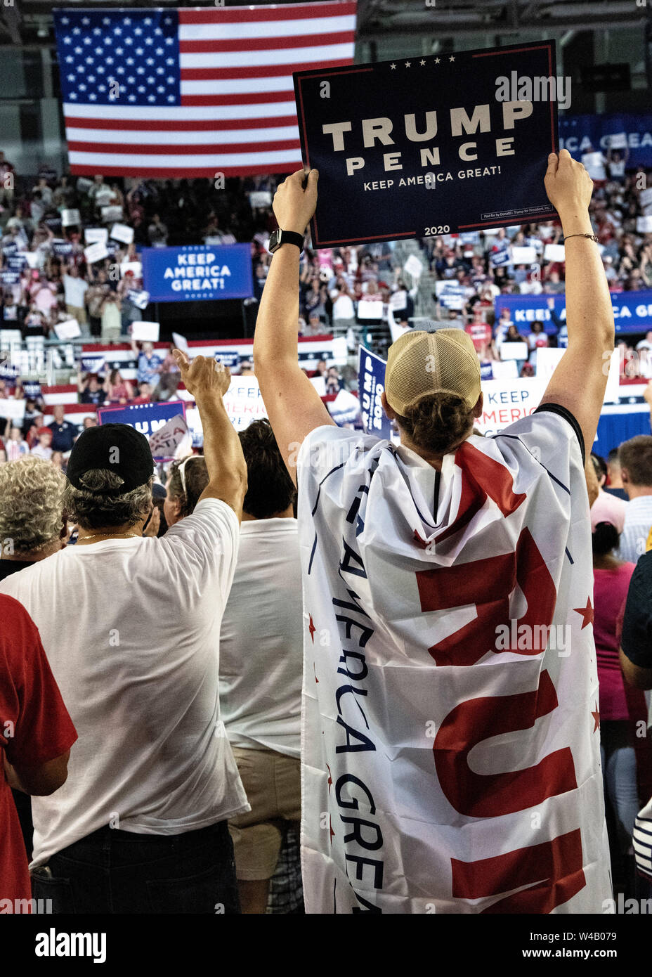 Supporters cheer U.S. President Donald Trump during a campaign rally in ...