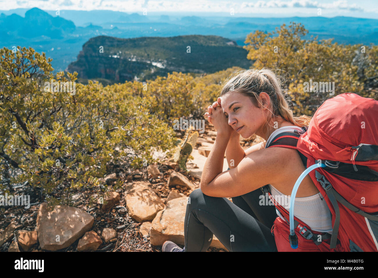 Backpacker Resting on Mountain Ridge Stock Photo - Alamy