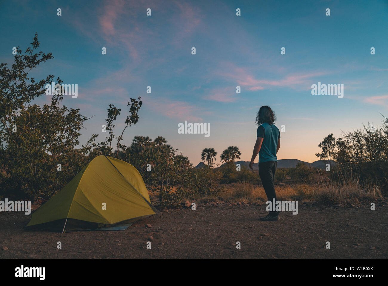 Watching Namibian Desert Sunset from Camp Stock Photo - Alamy