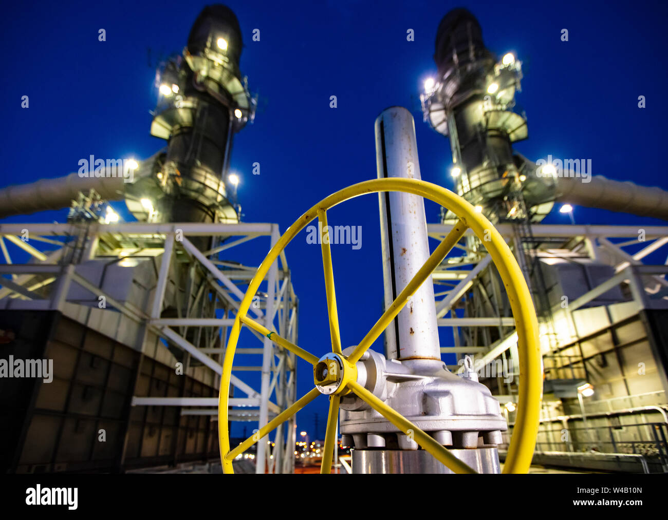 Refinery stacks as viewed during dusk Stock Photo - Alamy