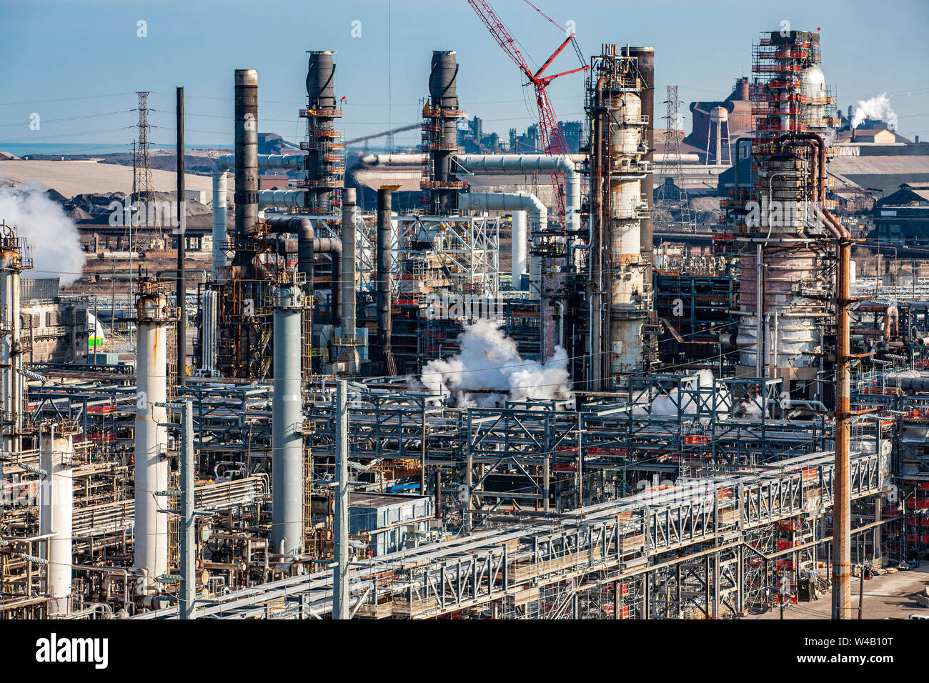 Aerial of refinery with construction in progress Stock Photo - Alamy