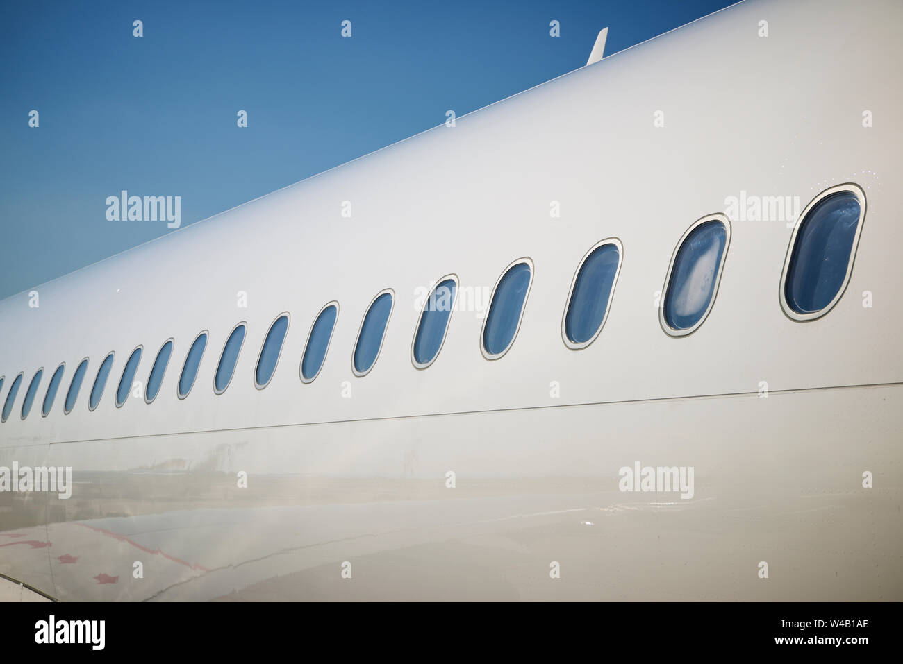 Windows of a passenger plane ready to take off Stock Photo - Alamy