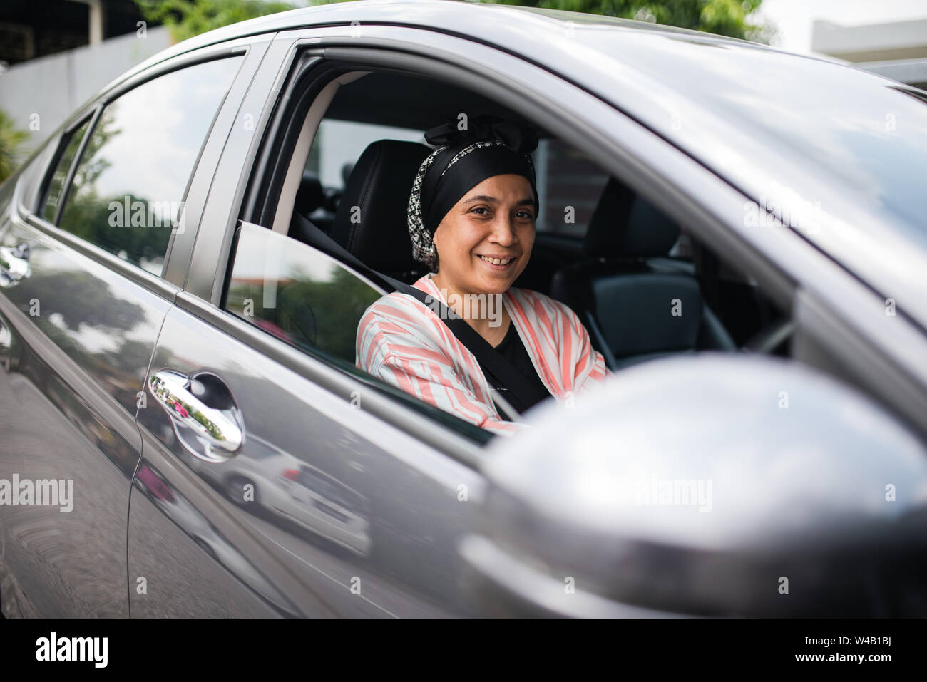 Asian woman driving car Stock Photo - Alamy