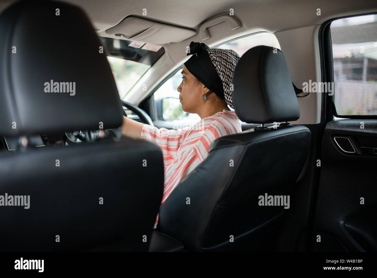 Asian woman driving car hi-res stock photography and images - Alamy