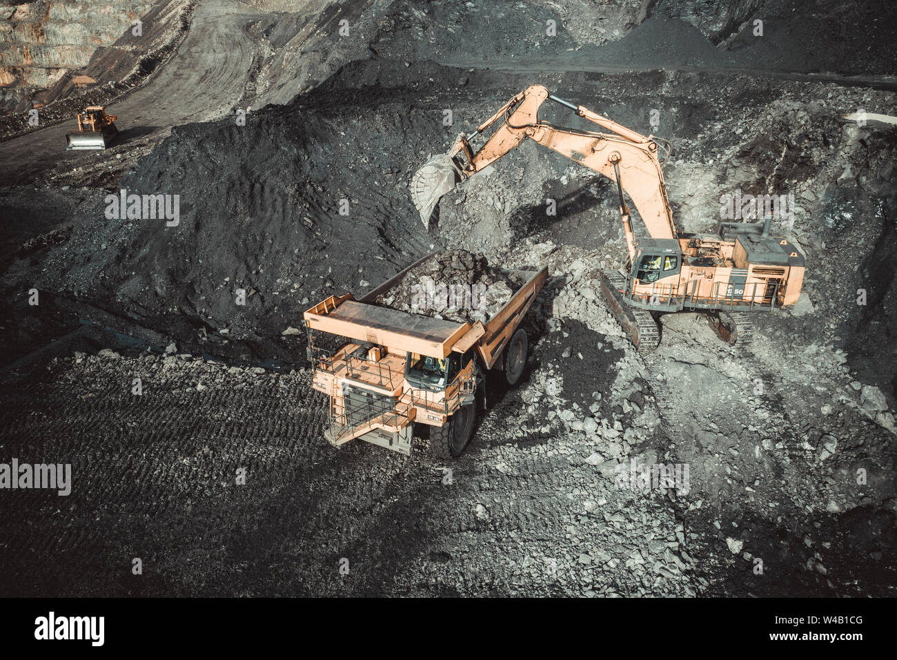 Excavator Loading Coal Truck from Aerial View Stock Photo - Alamy