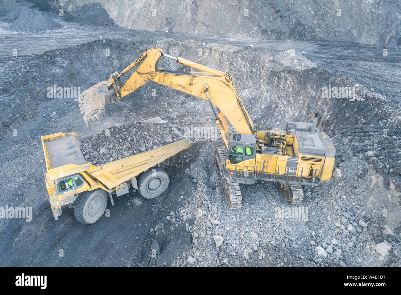 Excavator Loading Coal Truck from Aerial View Stock Photo - Alamy