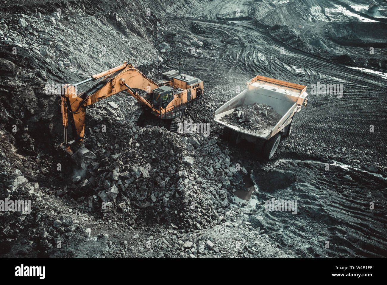 Excavator Loading Coal Truck from Aerial View Stock Photo - Alamy