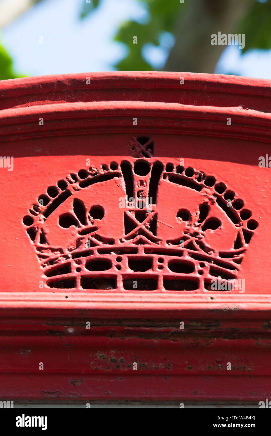 The Crown symbol on a red telephone box Stock Photo - Alamy