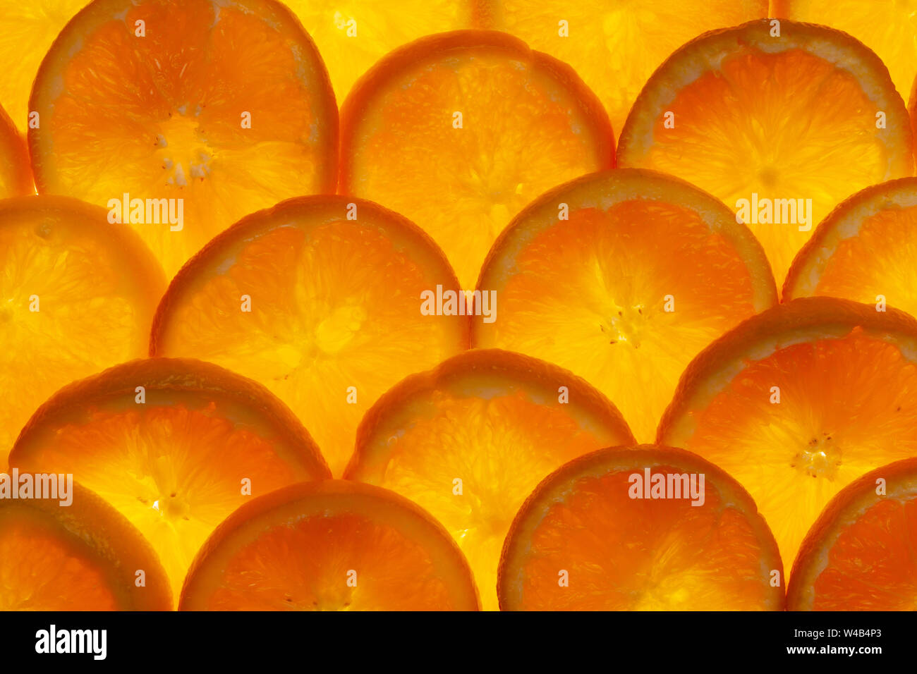 Back and front lit slices of oranges that would make an excellent ...