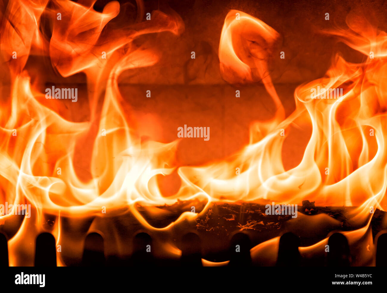 Relaxing fire in a closed fireplace Stock Photo - Alamy