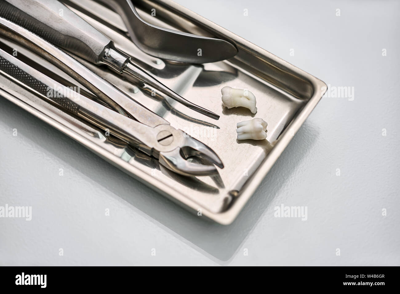 Dental instruments lying in chrome medical tray Stock Photo - Alamy