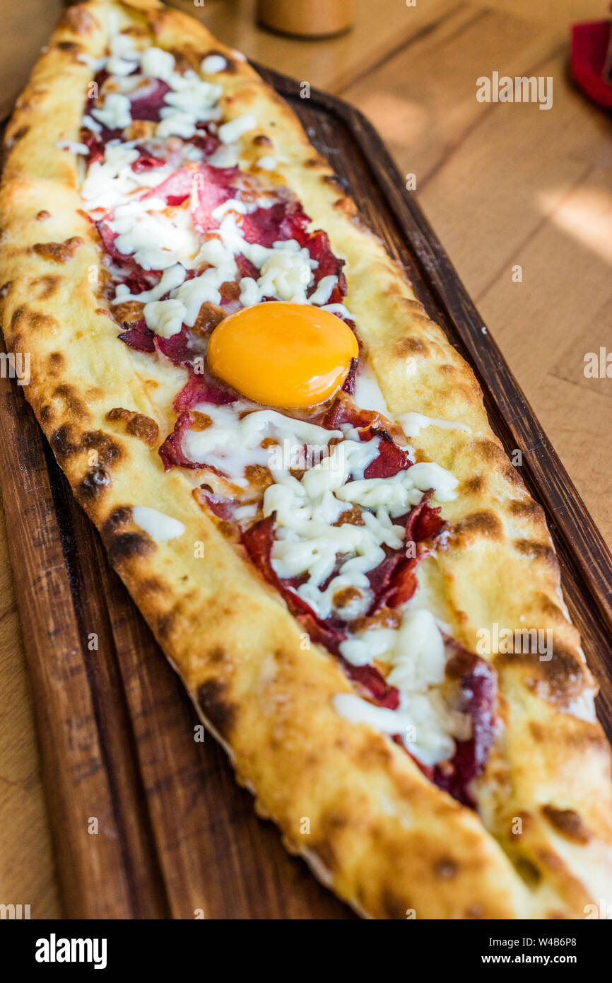 Traditional Turkish Pide at Kebab Restaurant on Wooden Table. Turkish ...