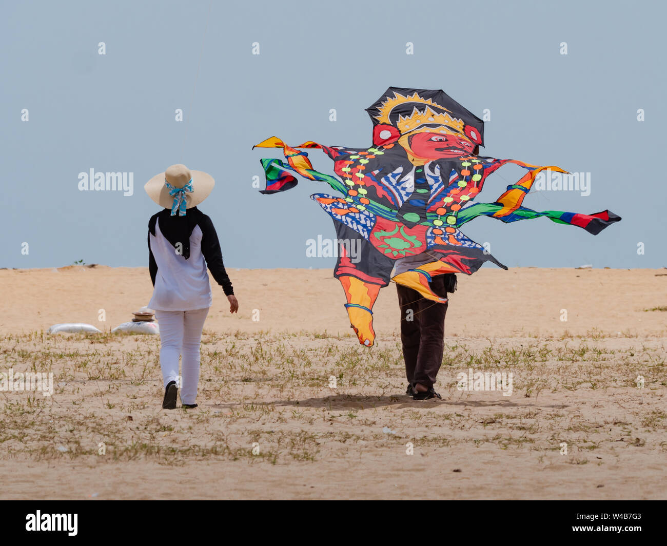 Kelantan, Malaysia - August 4, 2018: Indonesian kite flyer carrying his ...