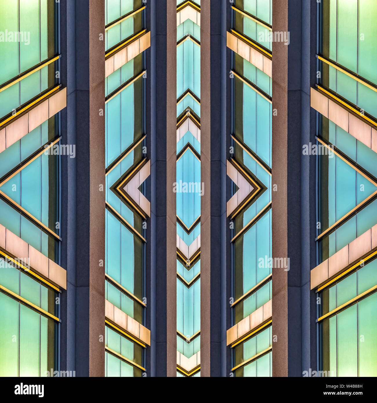 Shiny teal windows of an office building. Geometric kaleidoscope ...