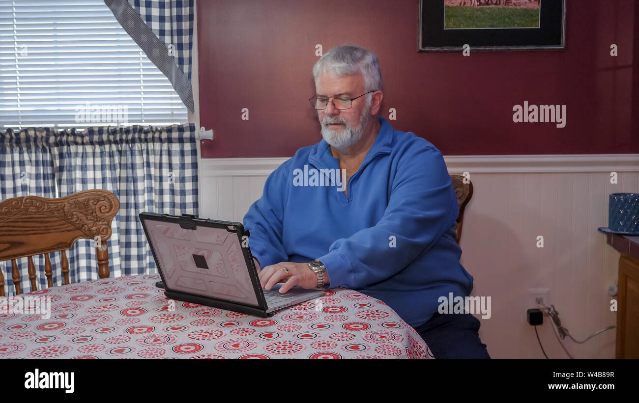 Senior Happy Using a Computer and Technology Stock Photo - Alamy