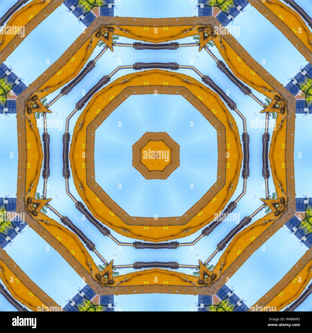 Emblem made from parts of a yellow tractor. Geometric kaleidoscope ...
