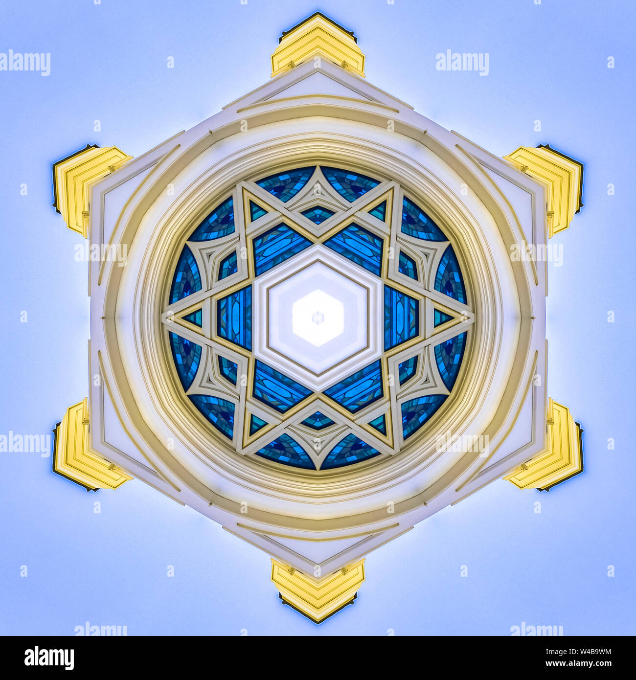 White temple church with windows reflected. Geometric kaleidoscope ...