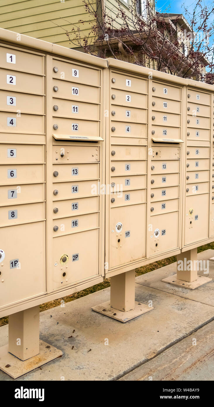 Vertical tall frame Residential mailboxes with numbered compartments on ...
