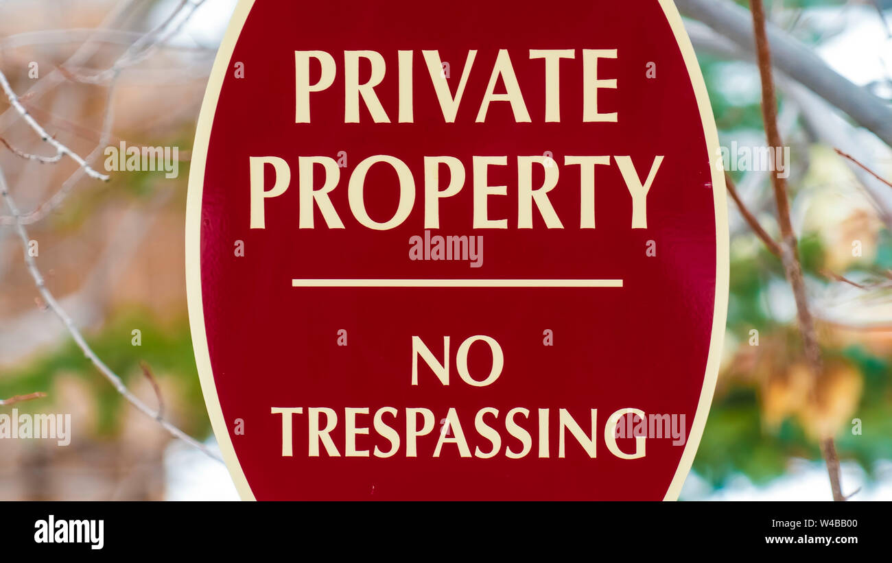 Panorama Oval shape Private Property No Trespassing sign with red and ...